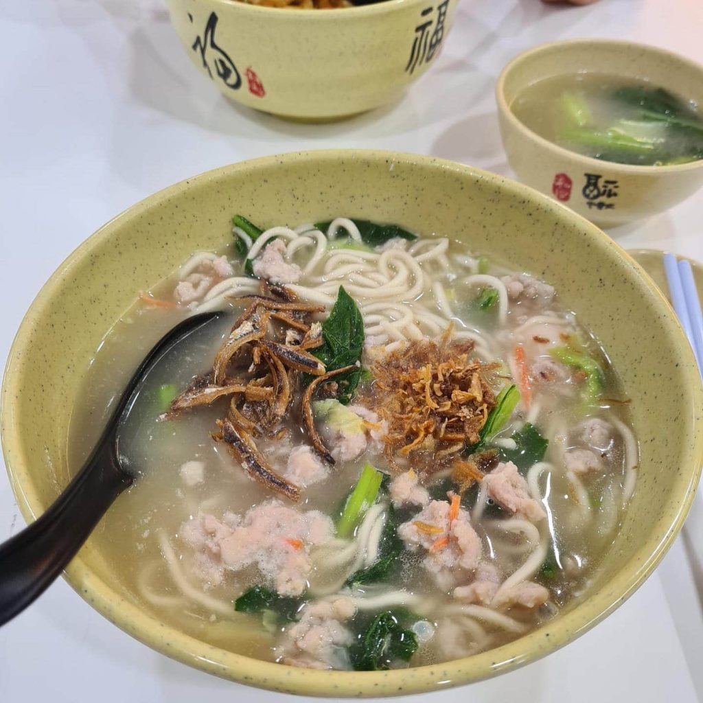 Enjoy a hearty bowl of tom yum ban mian from Wan Xiang Ting